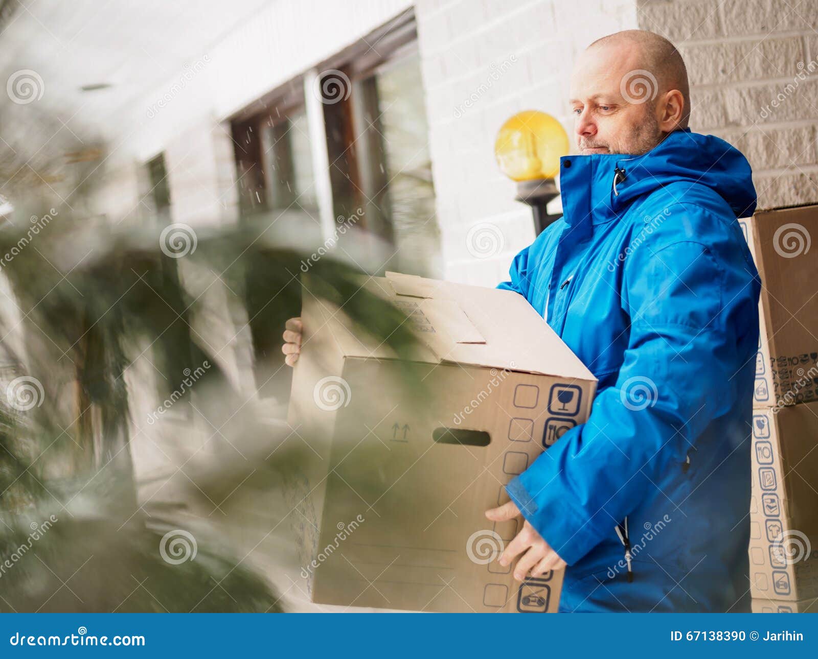 Man carrying moving boxes stock photo. Image of caucasian - 67138390