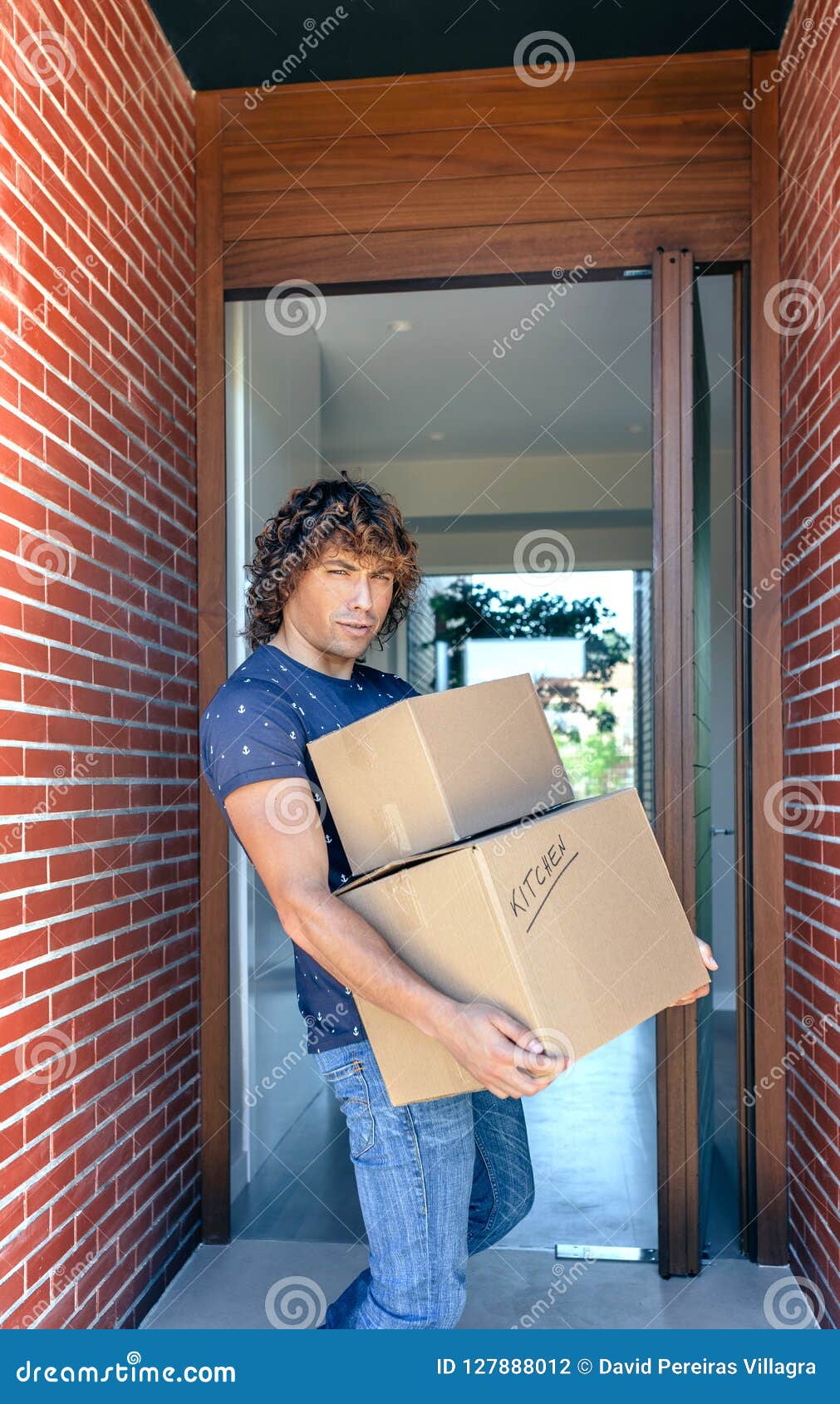 Man carrying moving boxes stock photo. Image of abode - 127888012