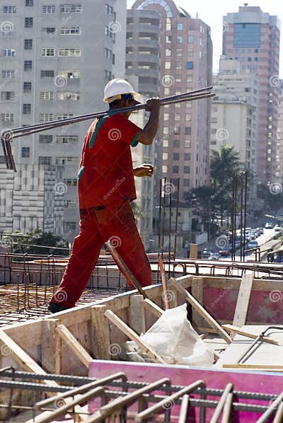Man Carrying Rebar - Vertical Stock Photo - Image of team, hard: 6041220