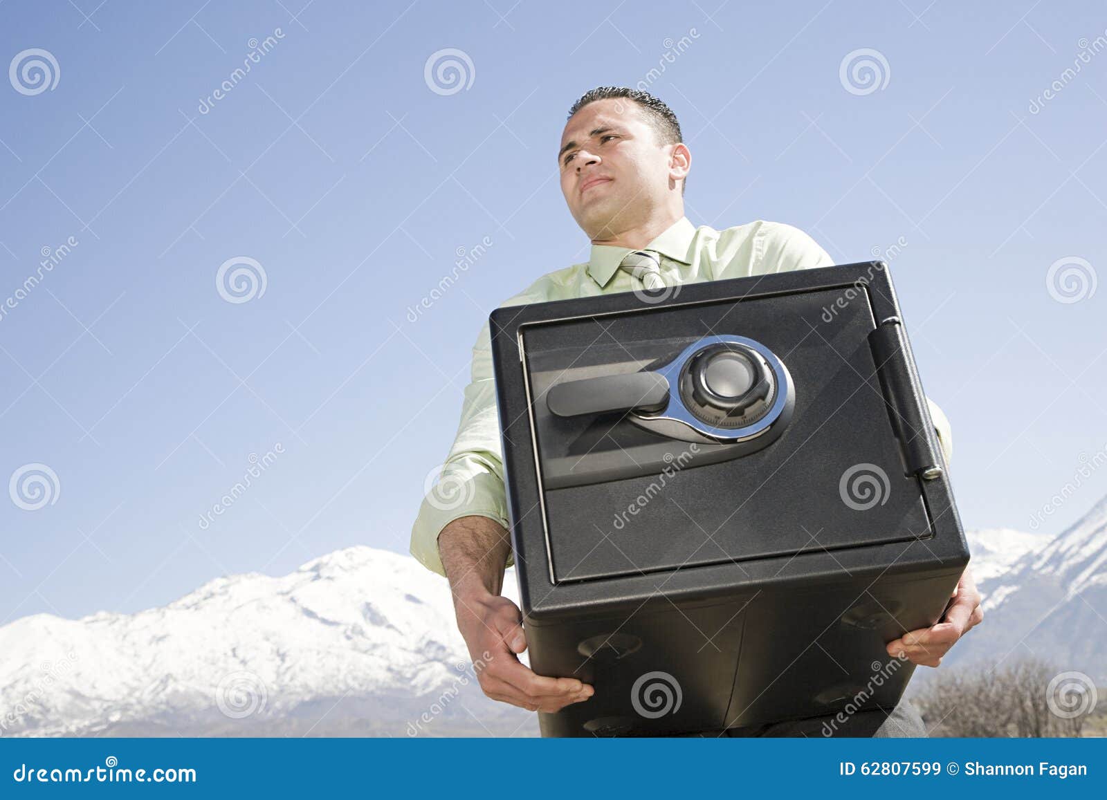 Man Carrying Safe Near Mountains Stock Image - Image of businessman ...