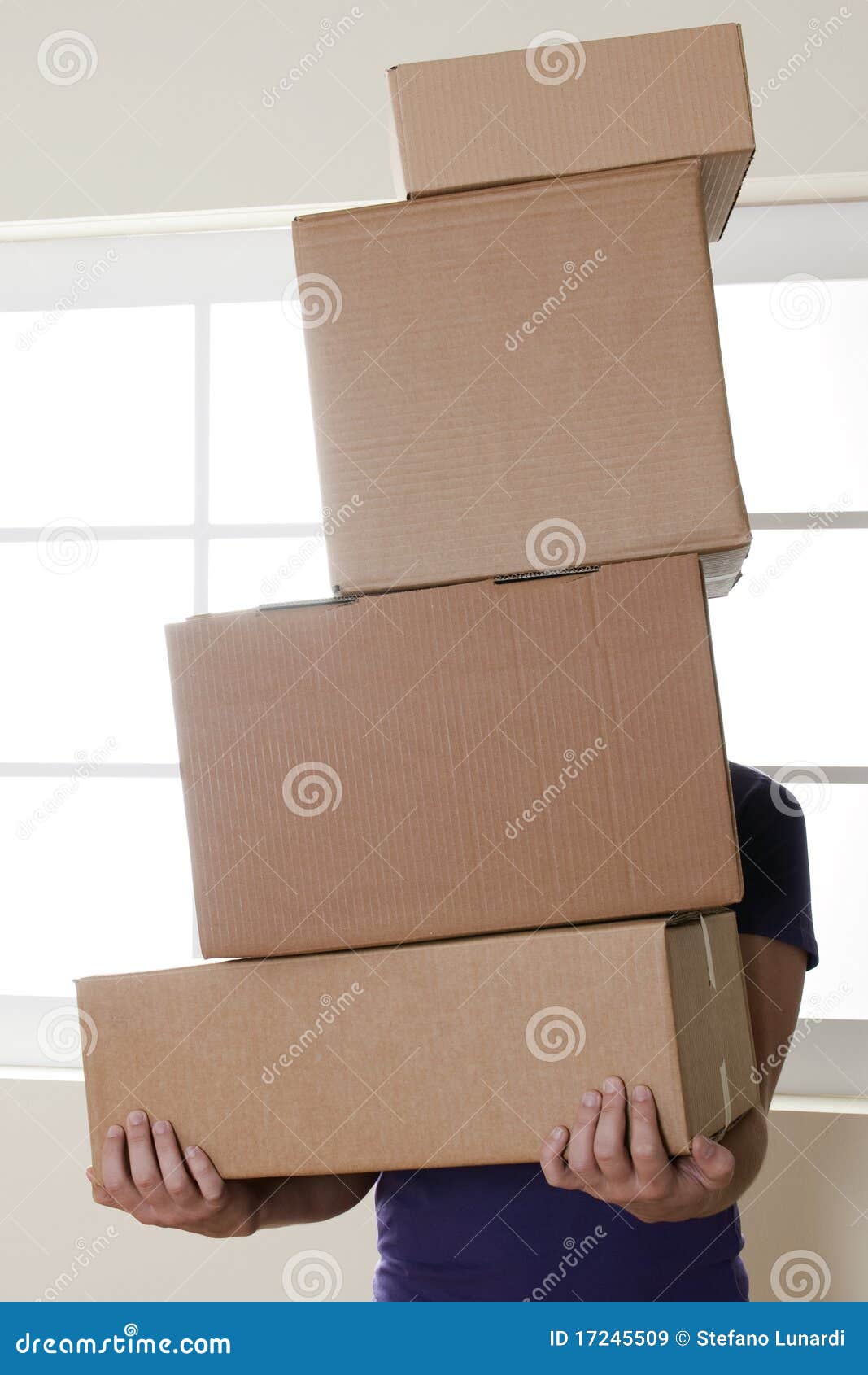 Man Carrying Stacked Boxes stock image. Image of brown - 17245509