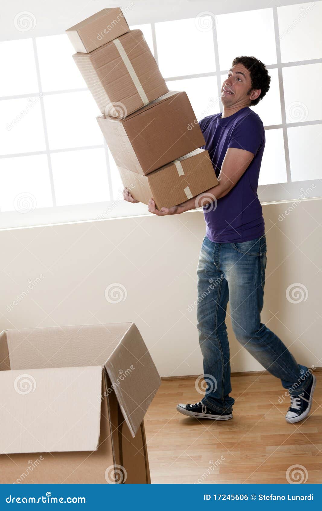 Man Carrying Stacked Boxes stock photo. Image of moving - 17245606