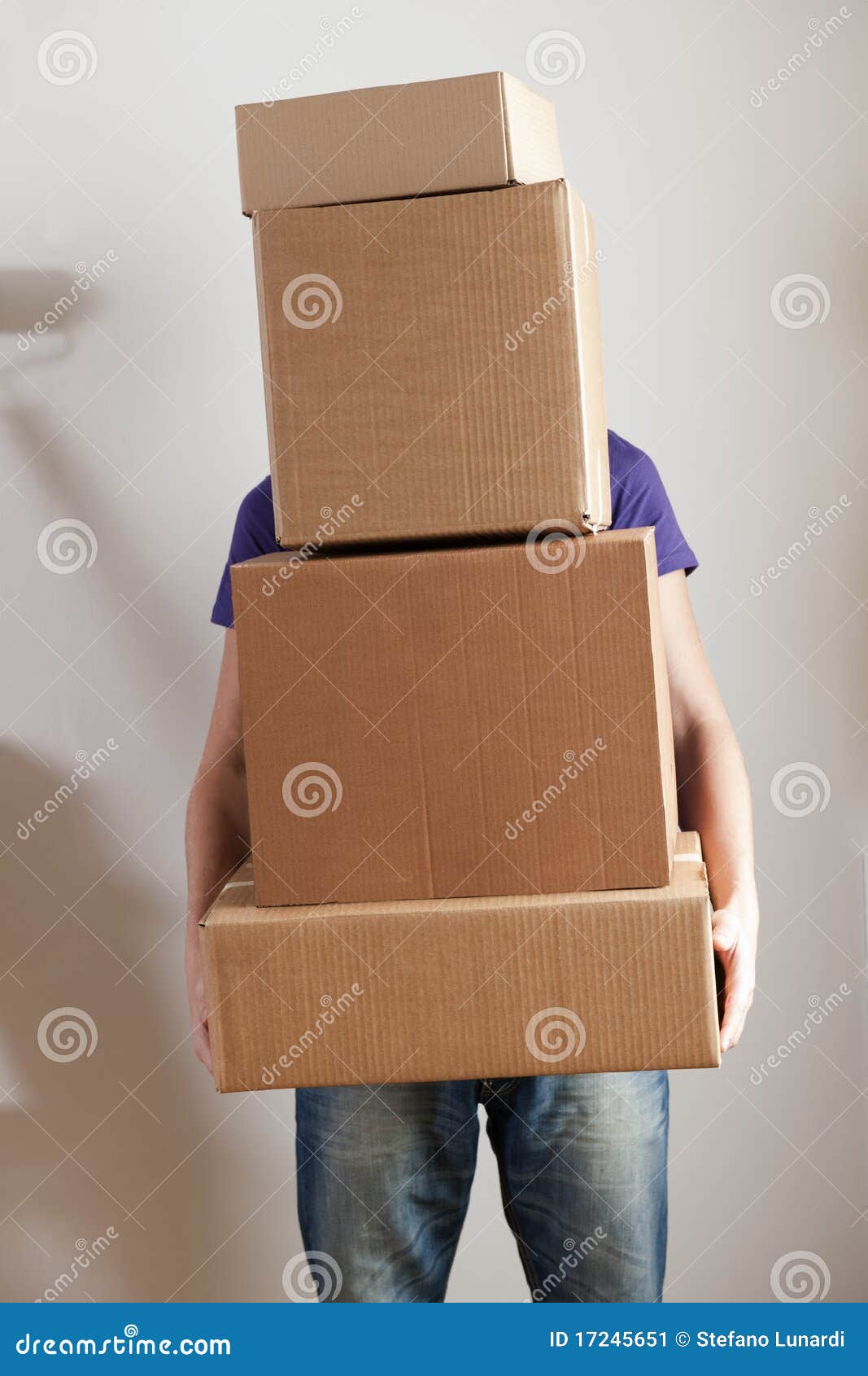Man Carrying Stacked Boxes stock image. Image of carrying - 17245651