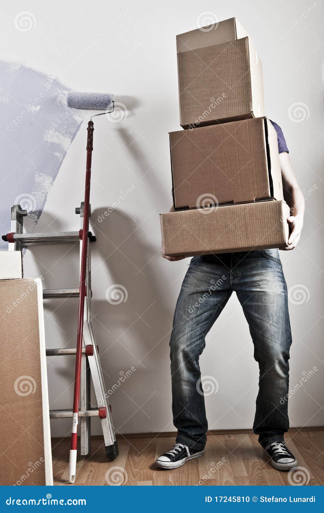 Man Carrying Stacked Boxes stock photo. Image of vertical - 17245810