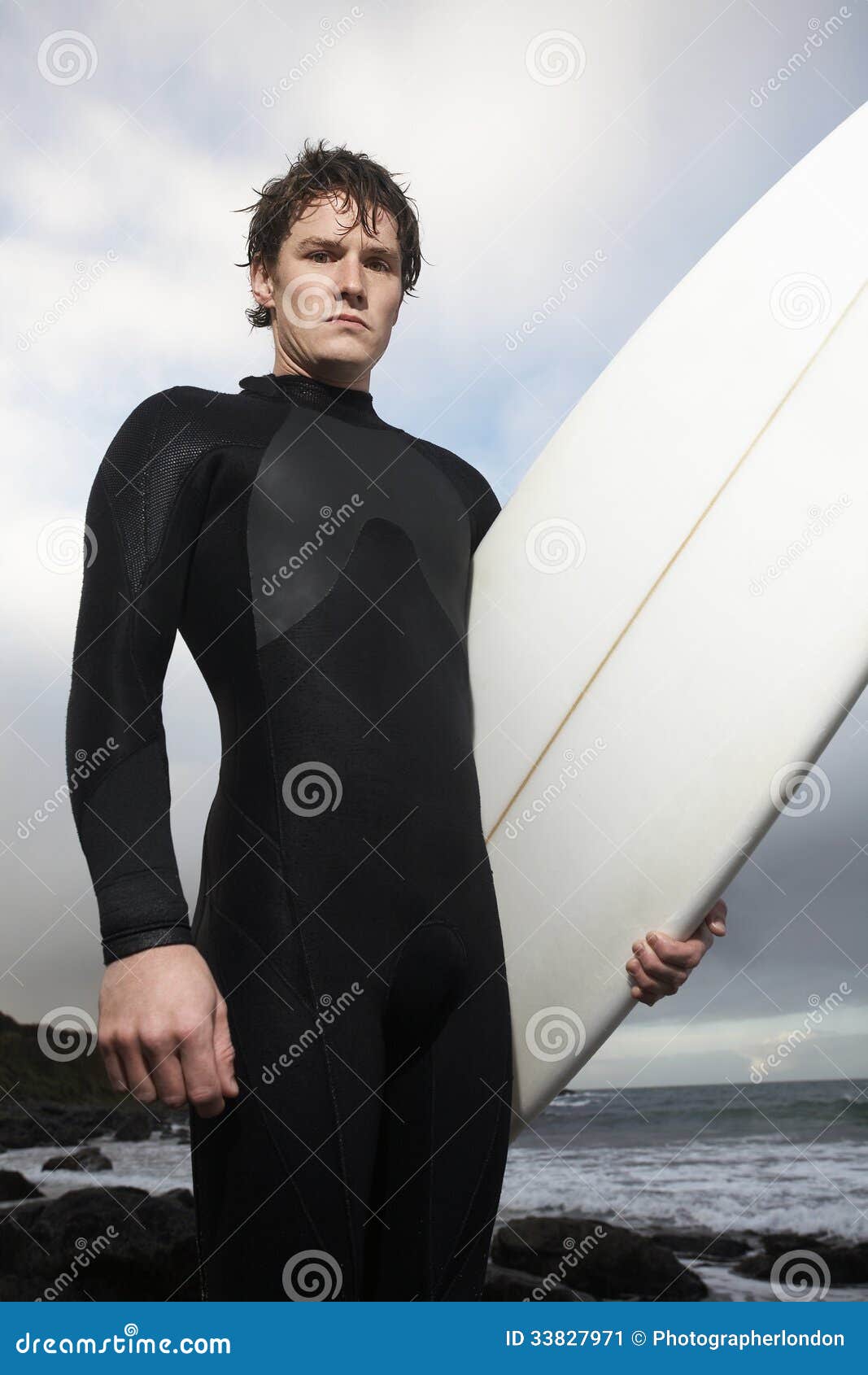 Man Carrying Surfboard on Beach Stock Image - Image of surfboard, cloud ...