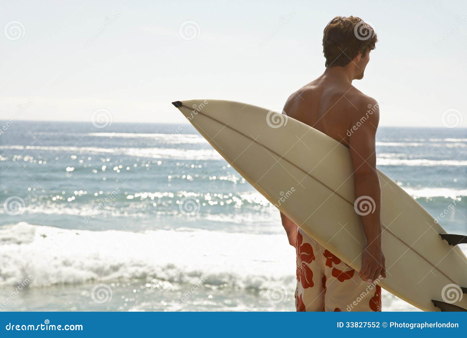 Man Carrying Surfboard Looking at Ocean Stock Photo - Image of sport ...