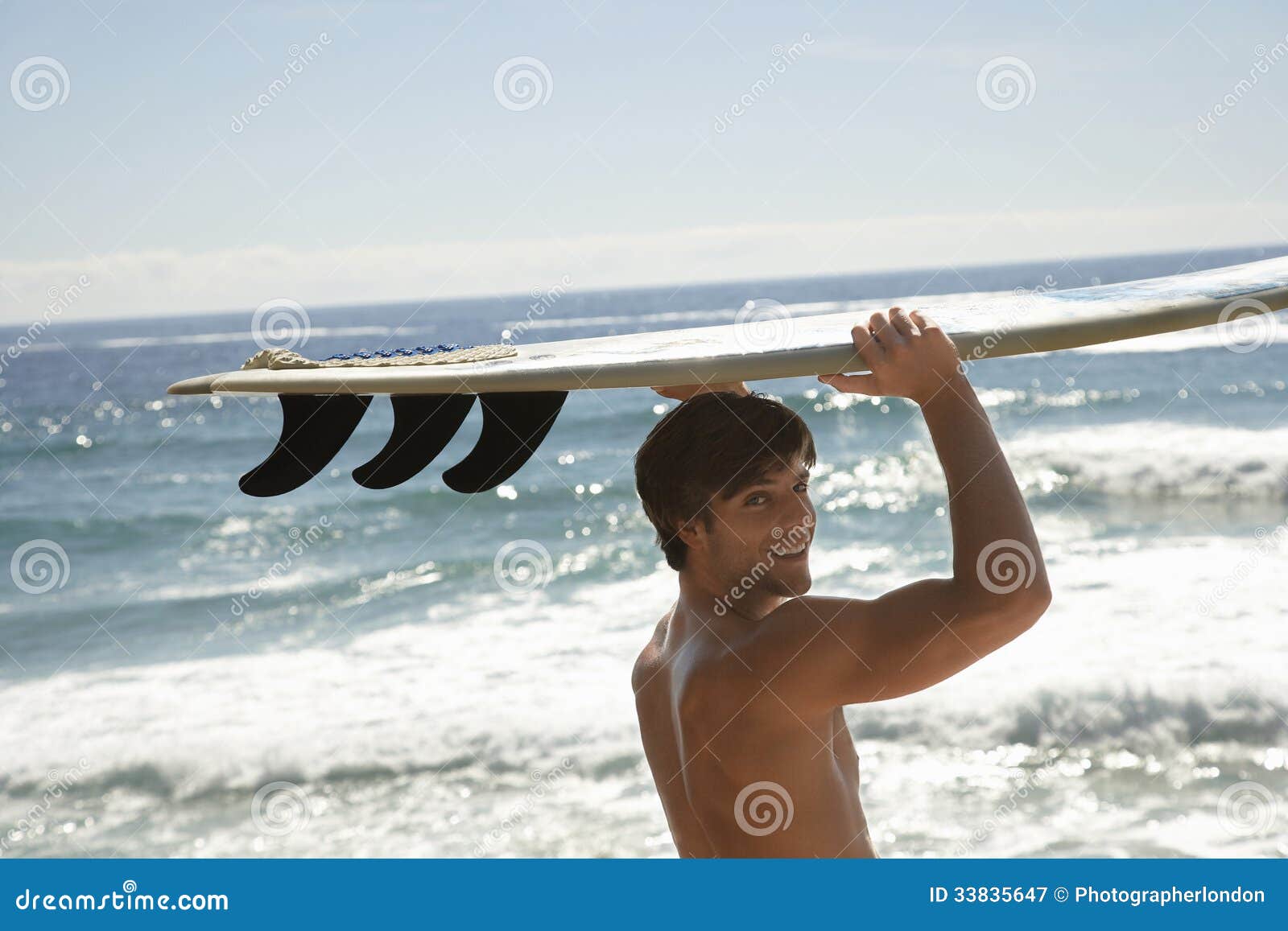Man Carrying Surfboard by Ocean Stock Image - Image of portrait ...