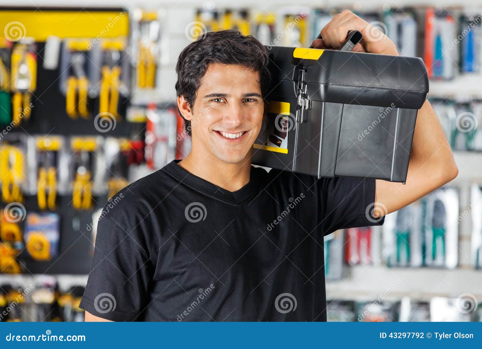 Man Carrying Toolbox on Shoulder in Hardware Store Stock Photo - Image ...