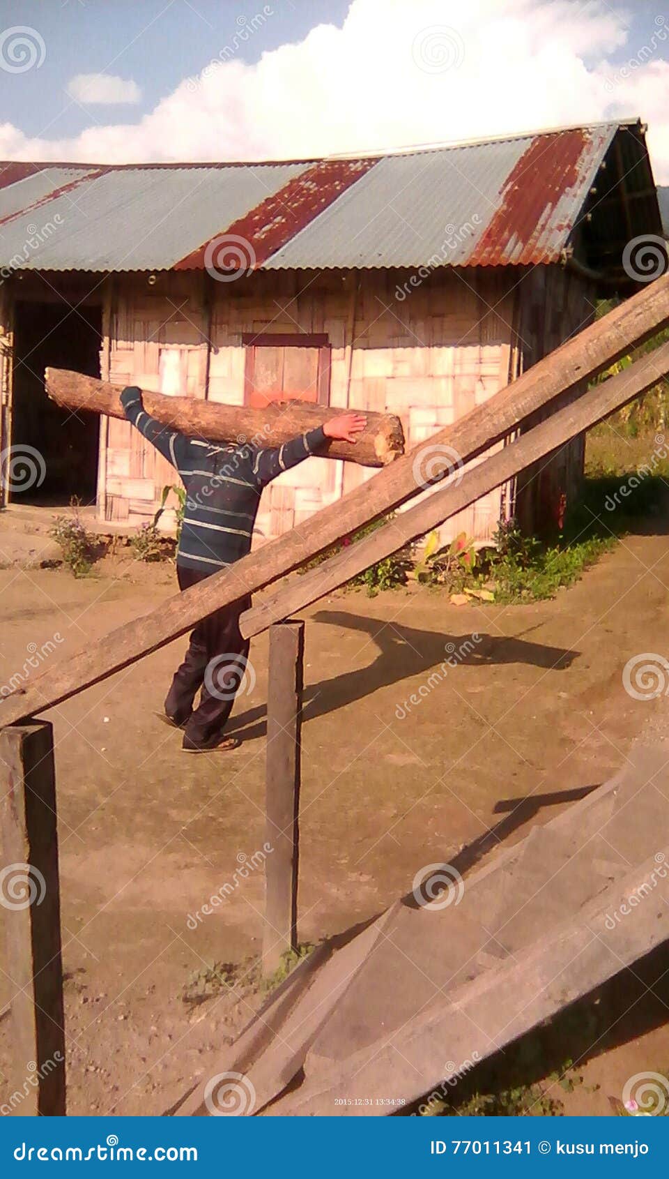 Man Carrying Tree Trunk editorial photo. Image of trunk - 77011341