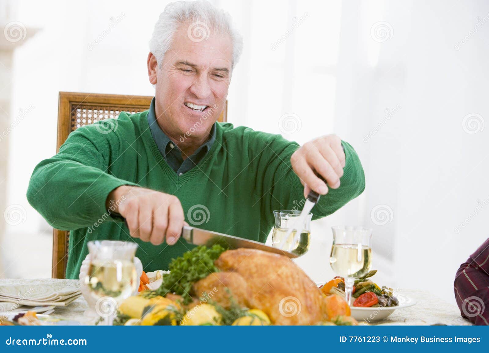 Man Carving Up Turkey at Christmas Dinner Stock Image - Image of ...