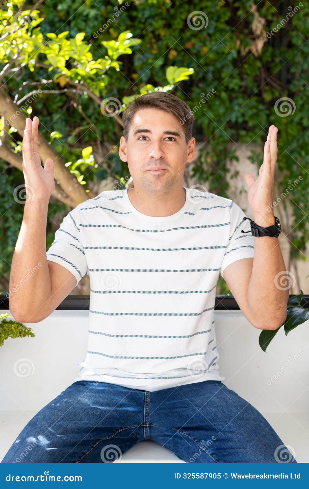 Man in Casual Wear on Video Call Outdoors, Raising Hands in Questioning Gesture Stock Image ...