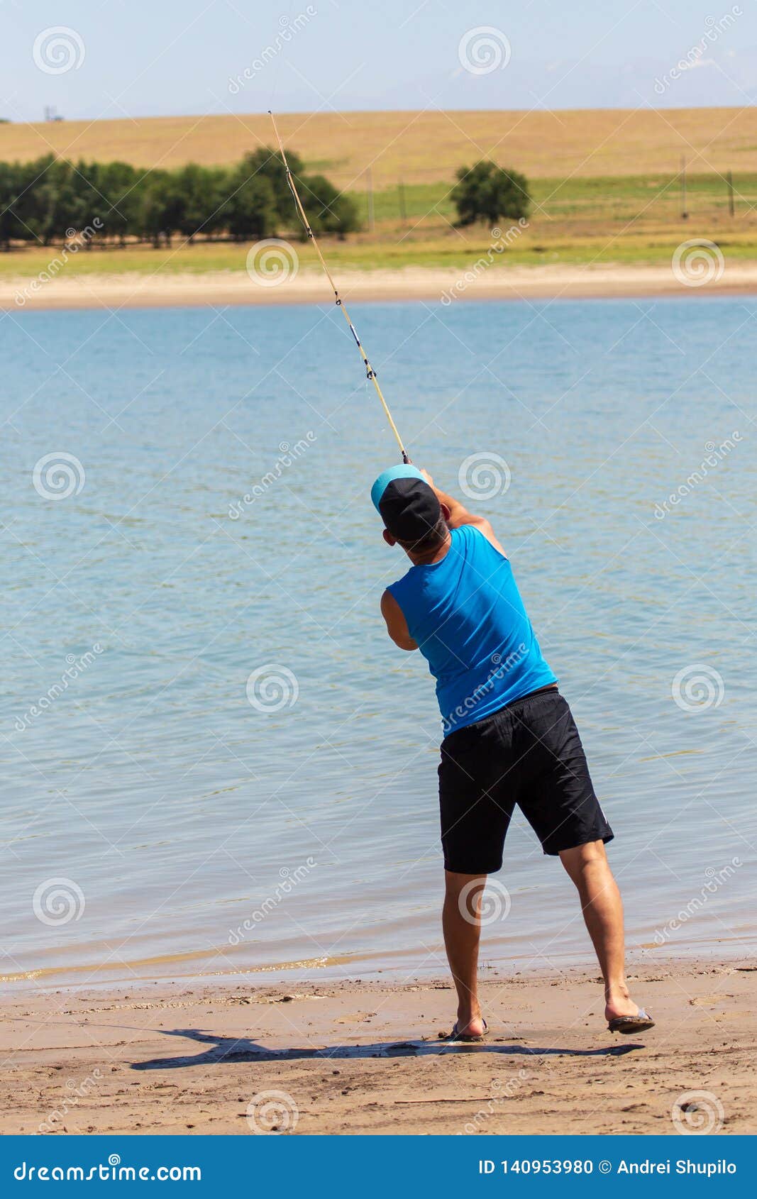 A Man Catches Fish on the Lake Stock Photo - Image of fisherman, male ...
