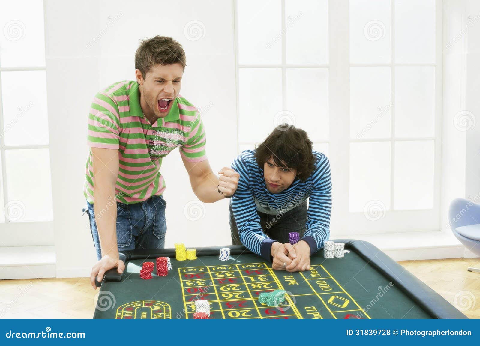 Man Celebrating Gambling Win at Roulette Table Stock Photo - Image of ...