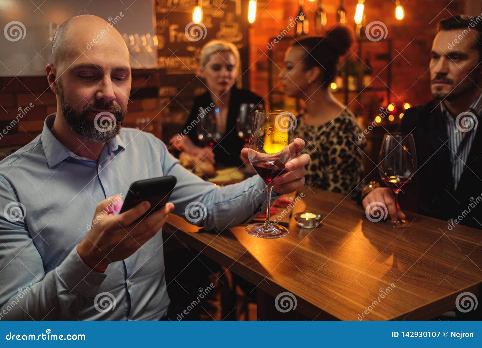 Man with Cell Phone Behind Bar Counter in a Cafe Stock Image - Image of ...
