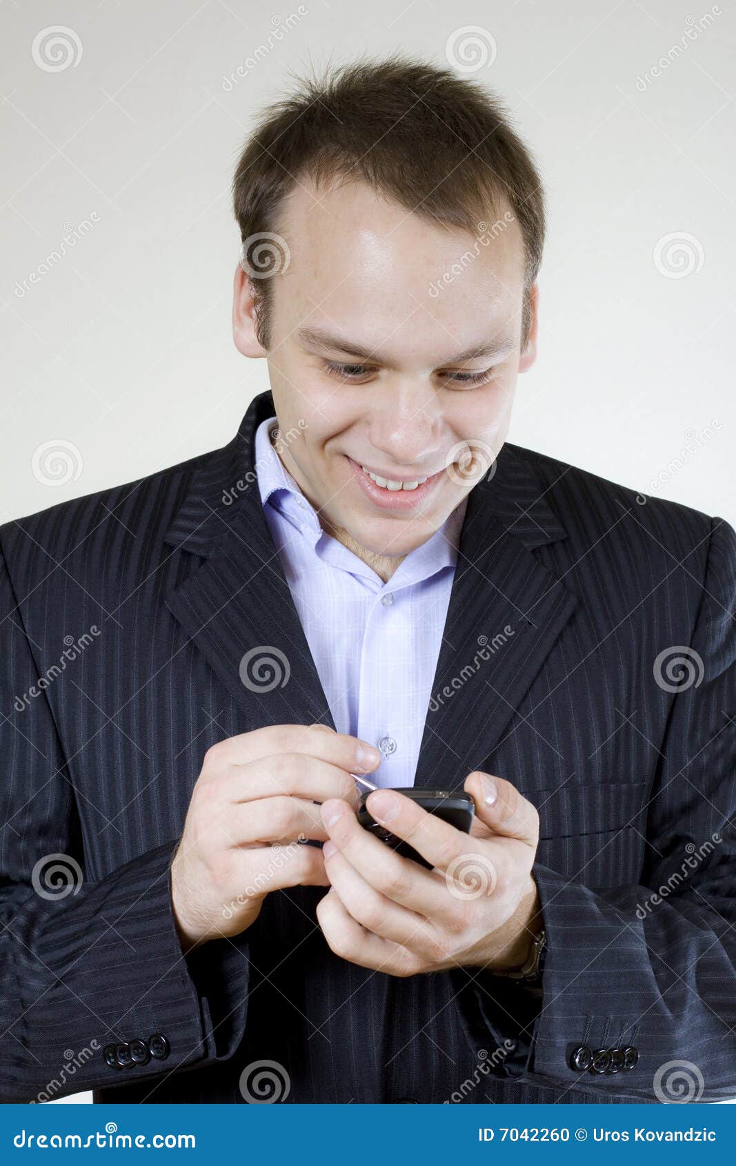 Man with Cellphone Very Happy Stock Photo - Image of posing, suit: 7042260