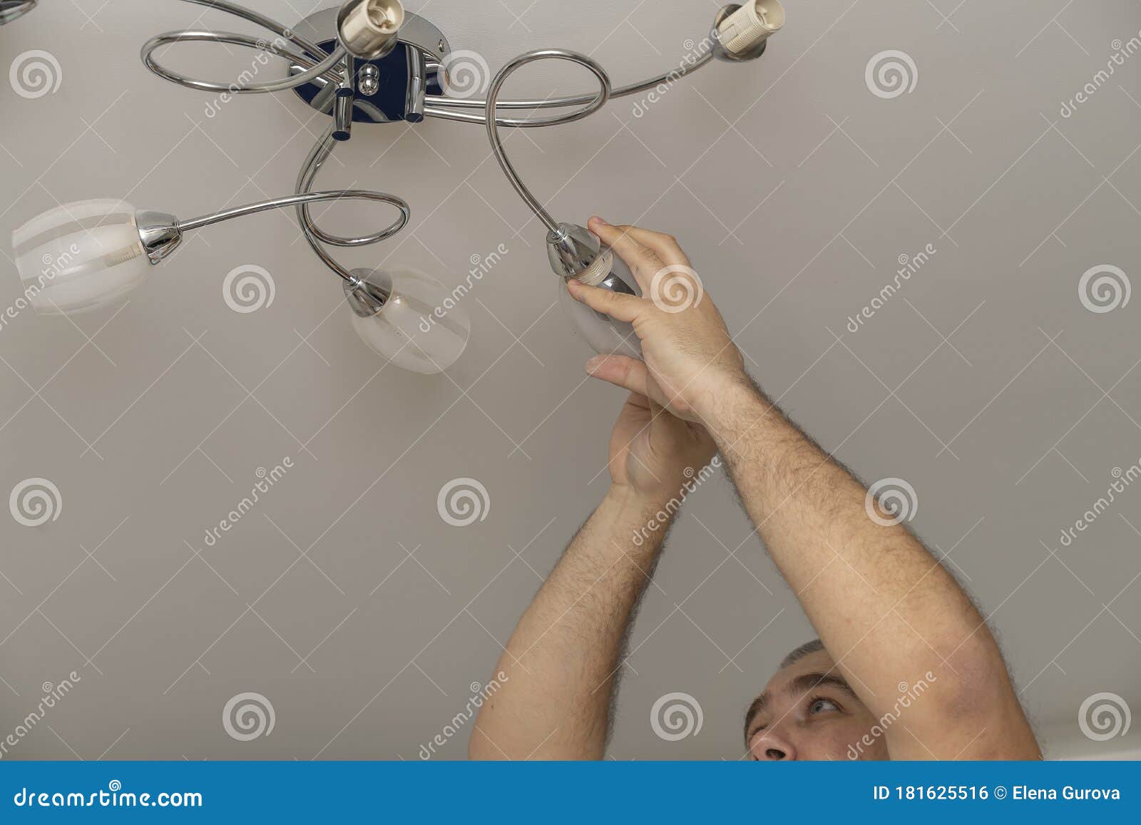 Man Changes a Light Bulb in a Lighting Device Stock Photo - Image of ...
