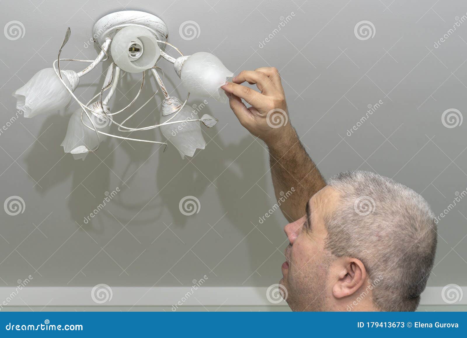 Man Changes a Light Bulb in a Lighting Device Stock Image - Image of ...