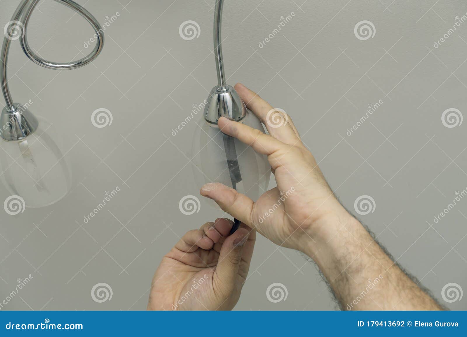 Man Changes a Light Bulb in a Lighting Device Stock Photo - Image of ...