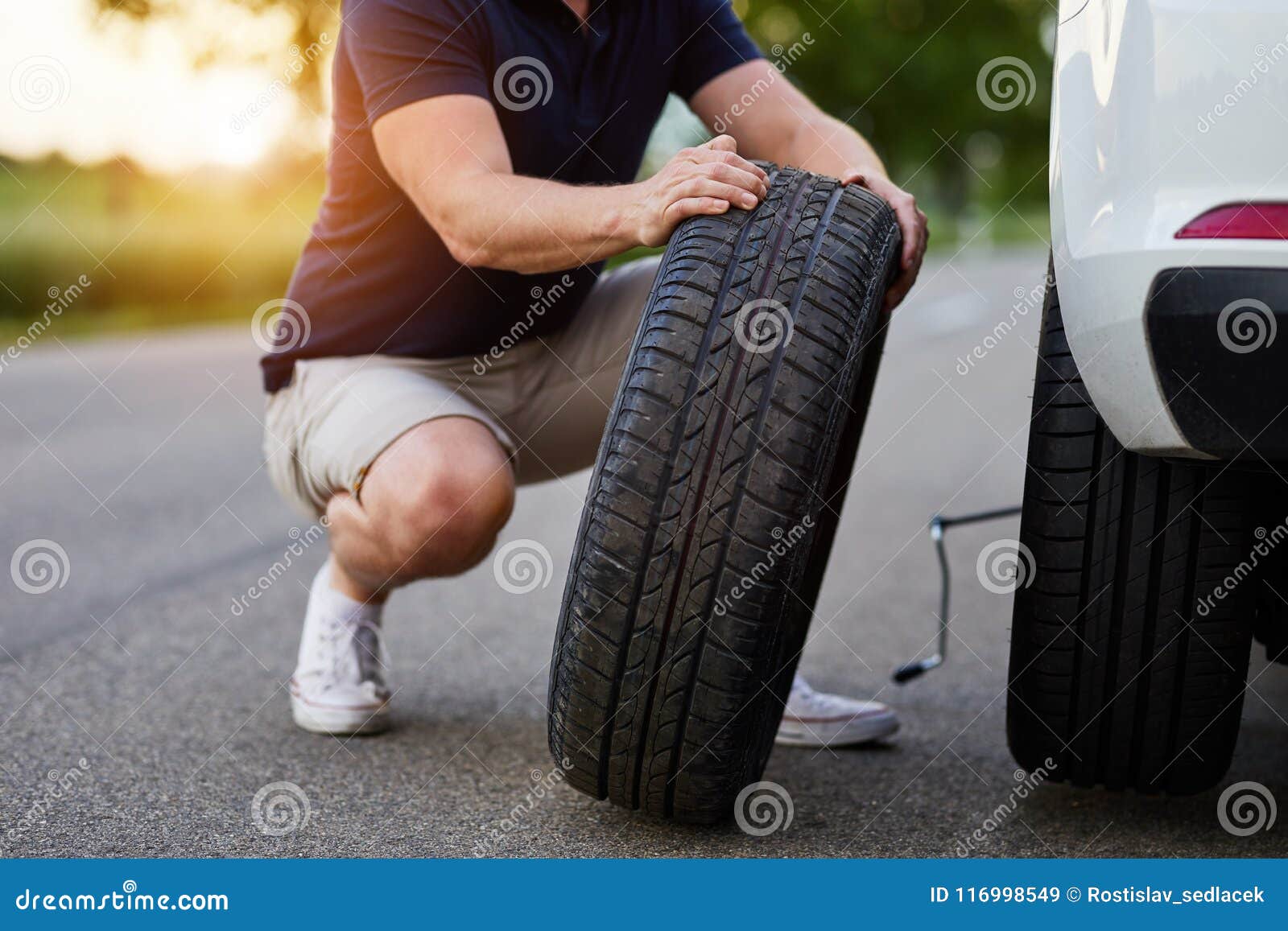 The Man Changes the Tire To a Broken Car Stock Image - Image of ...