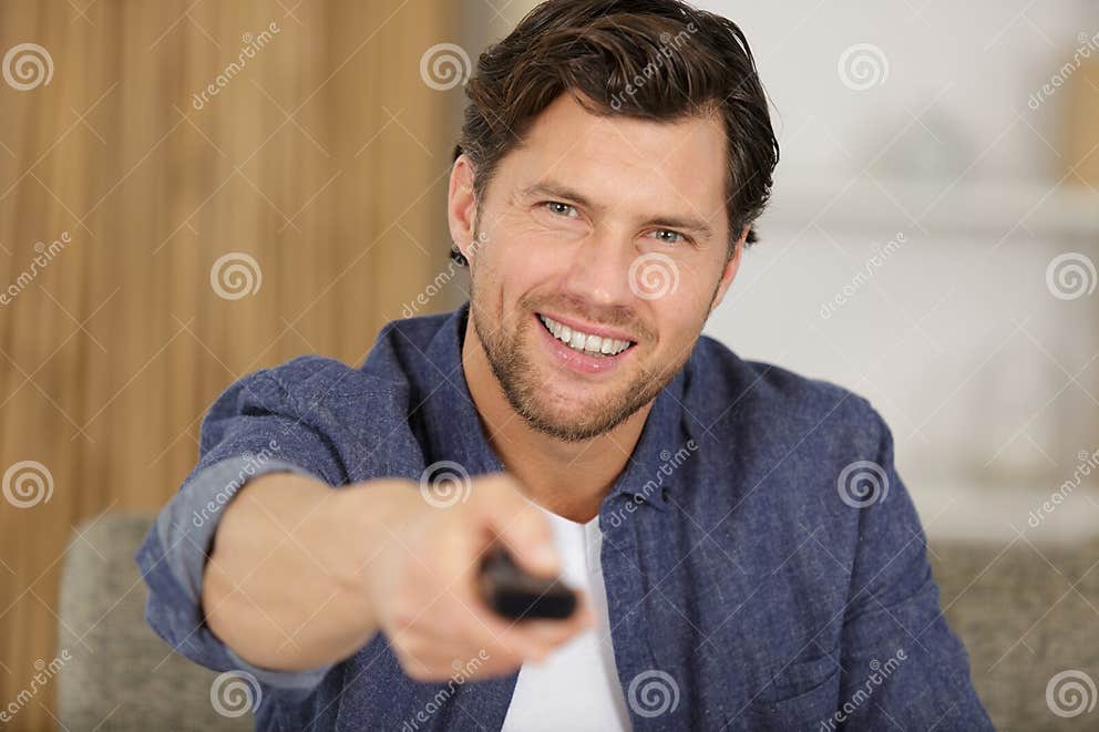 Man Changing Channel with Remote Control Stock Photo - Image of people ...