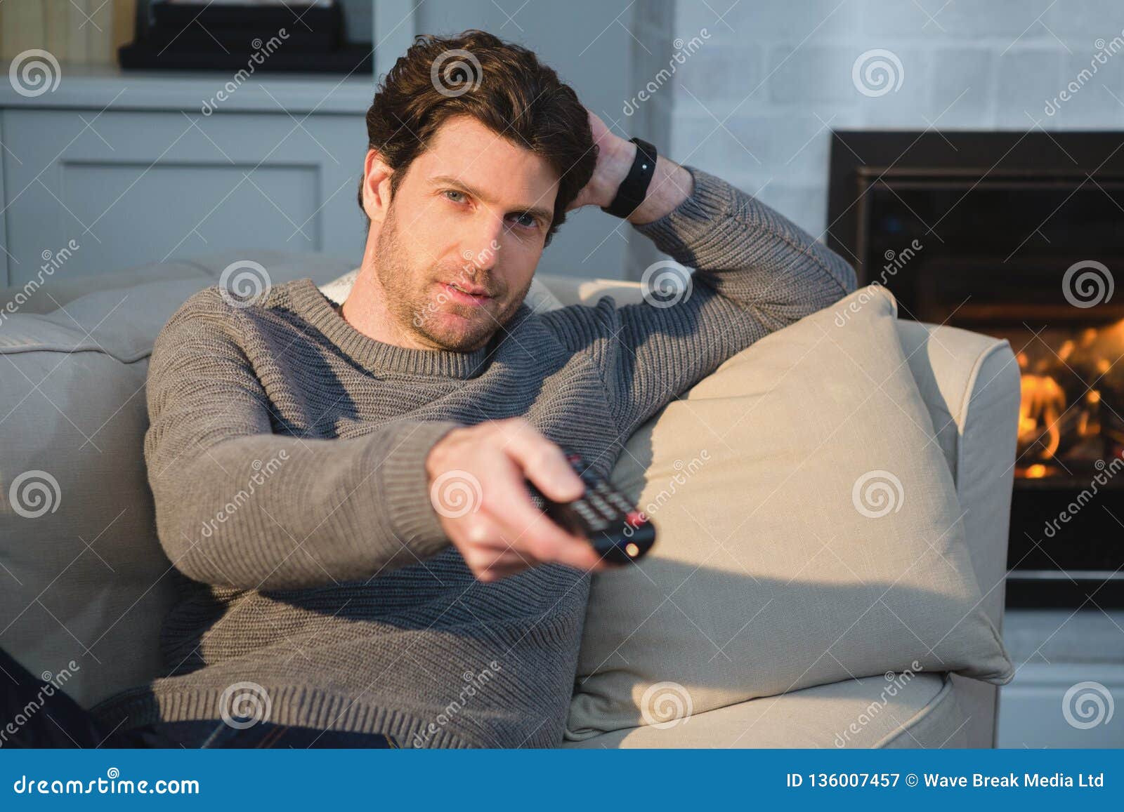 Man Changing Channel with Remote Control Stock Image - Image of ...