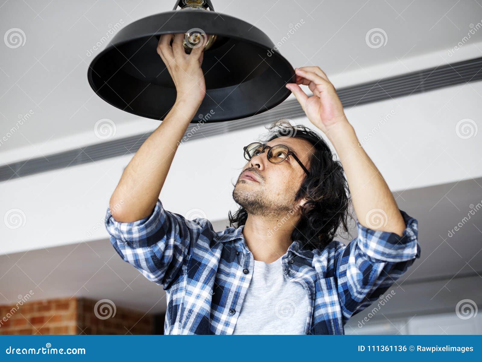 Man Changing the Light Bulb Stock Photo - Image of energy, condo: 111361136