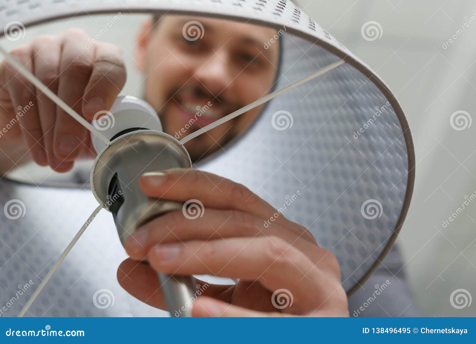 Man Changing Light Bulb in Lamp, Closeup Stock Image - Image of ...