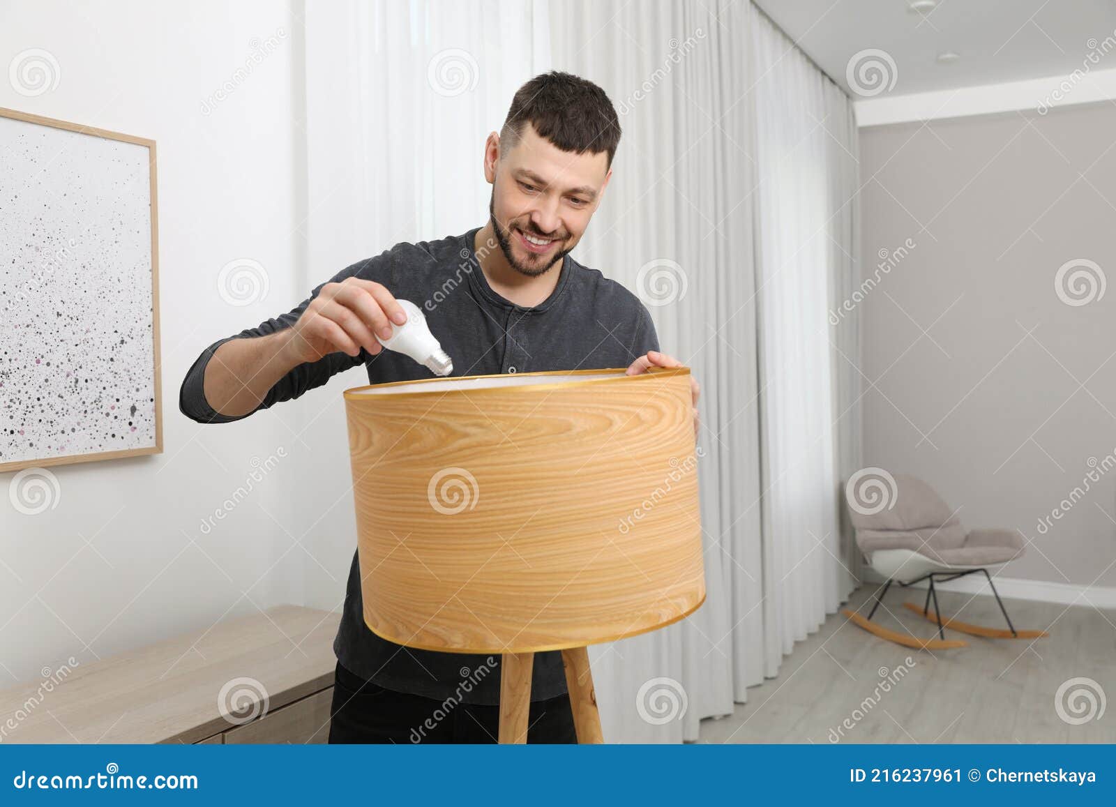 Man Changing Light Bulb in Lamp at Home Stock Image - Image of ...