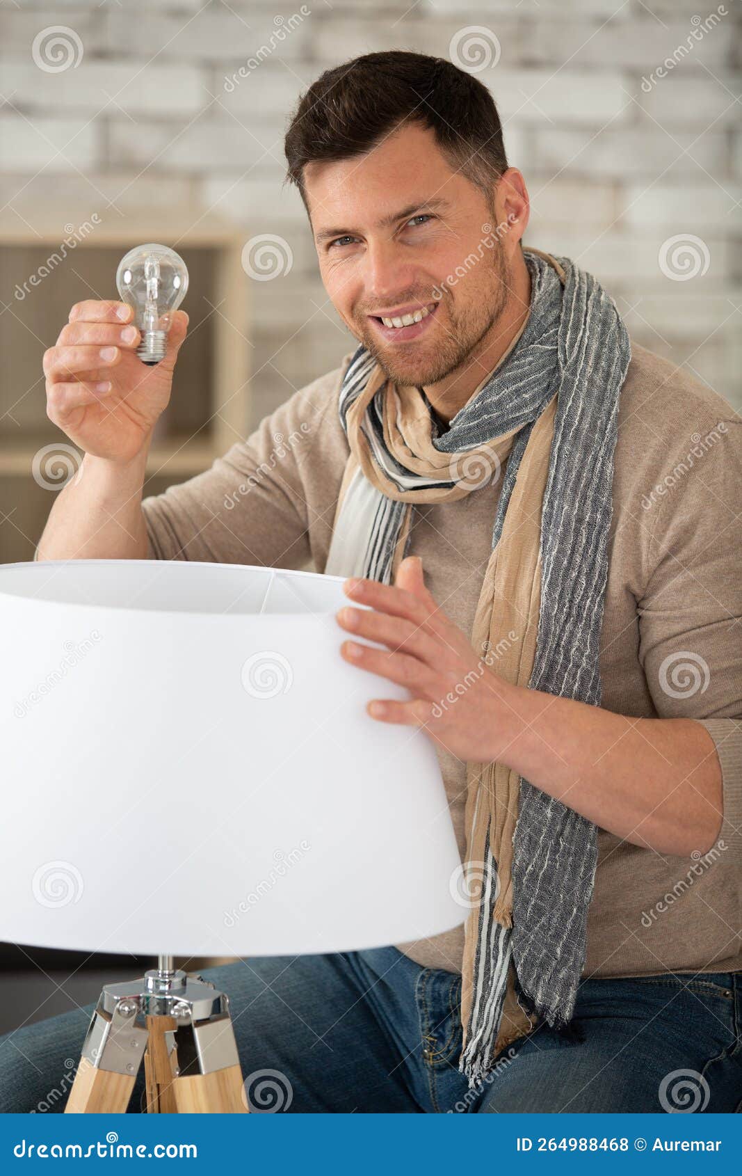 Man Changing Light Bulb in Lamp Indoors Stock Photo - Image of ...