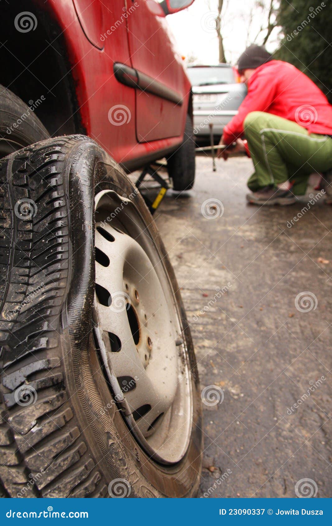 Man Changing a Tire on the Street Stock Image - Image of fixing ...