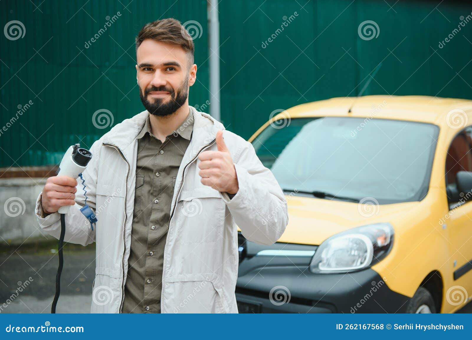 Man Charging Electric Car by the Work Stock Photo - Image of motor ...