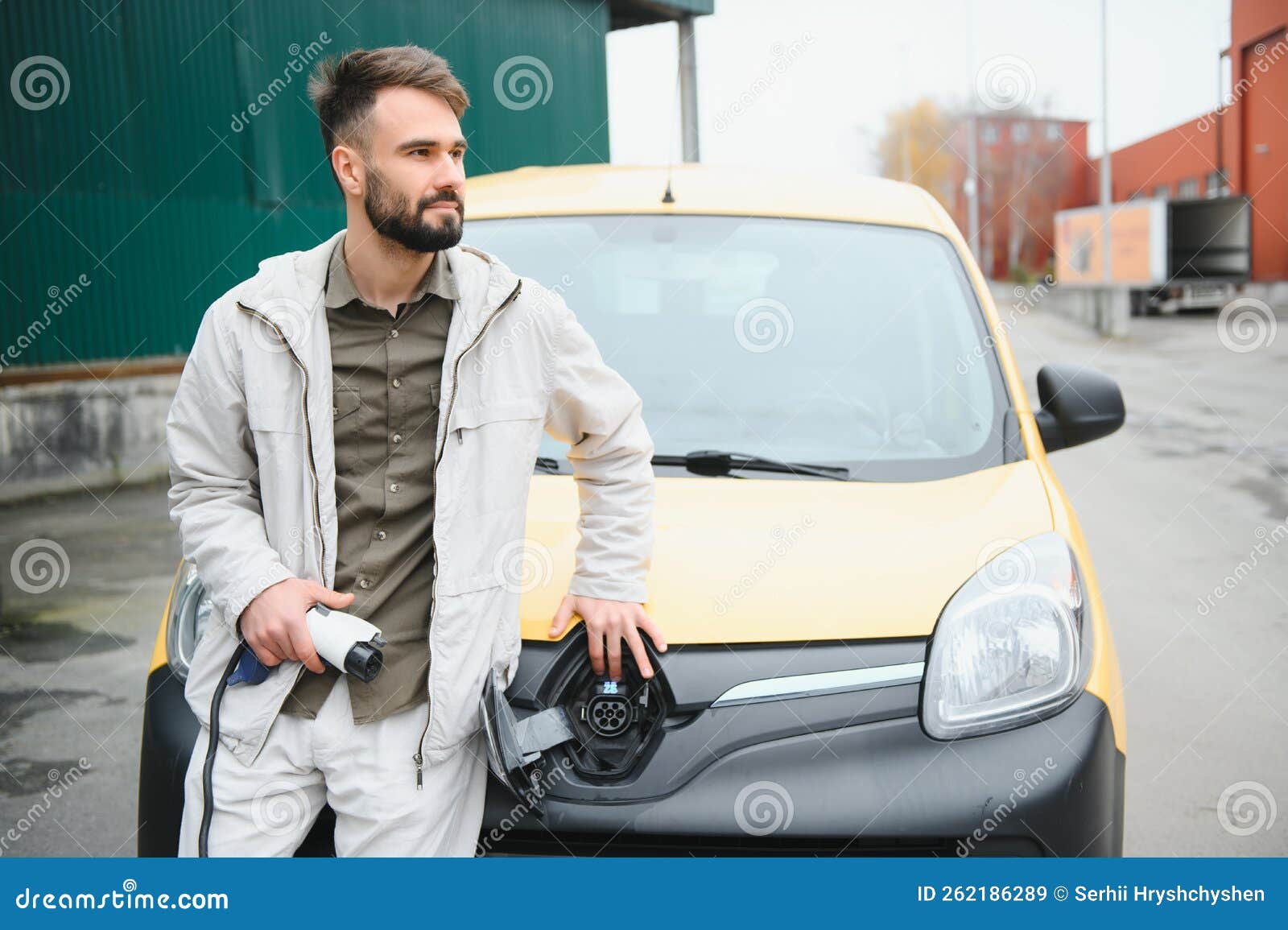Man Charging Electric Car by the Work Stock Image - Image of caucasian ...