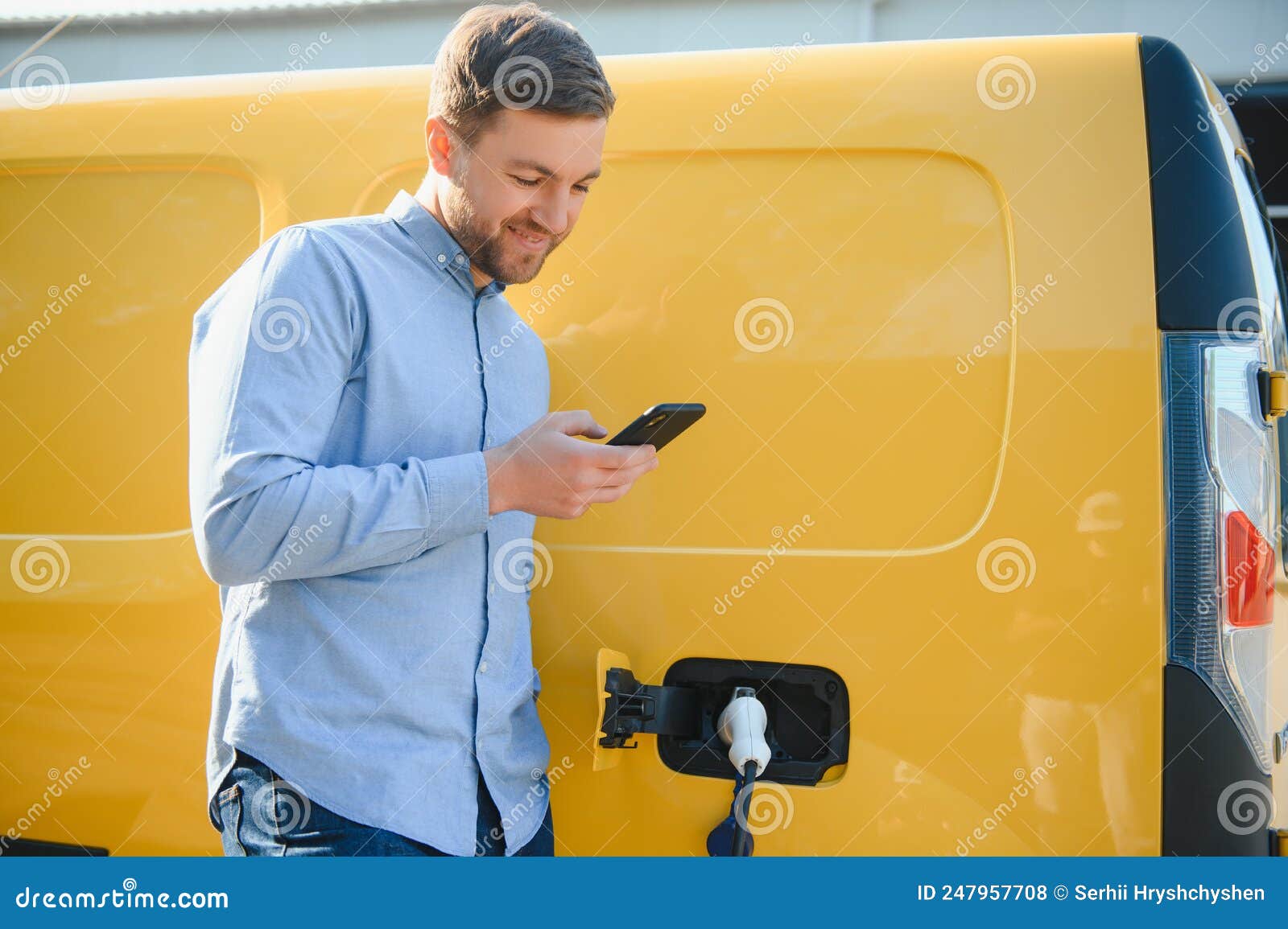 Man Charging Electric Vehicle with Cable Stock Photo - Image of supply ...