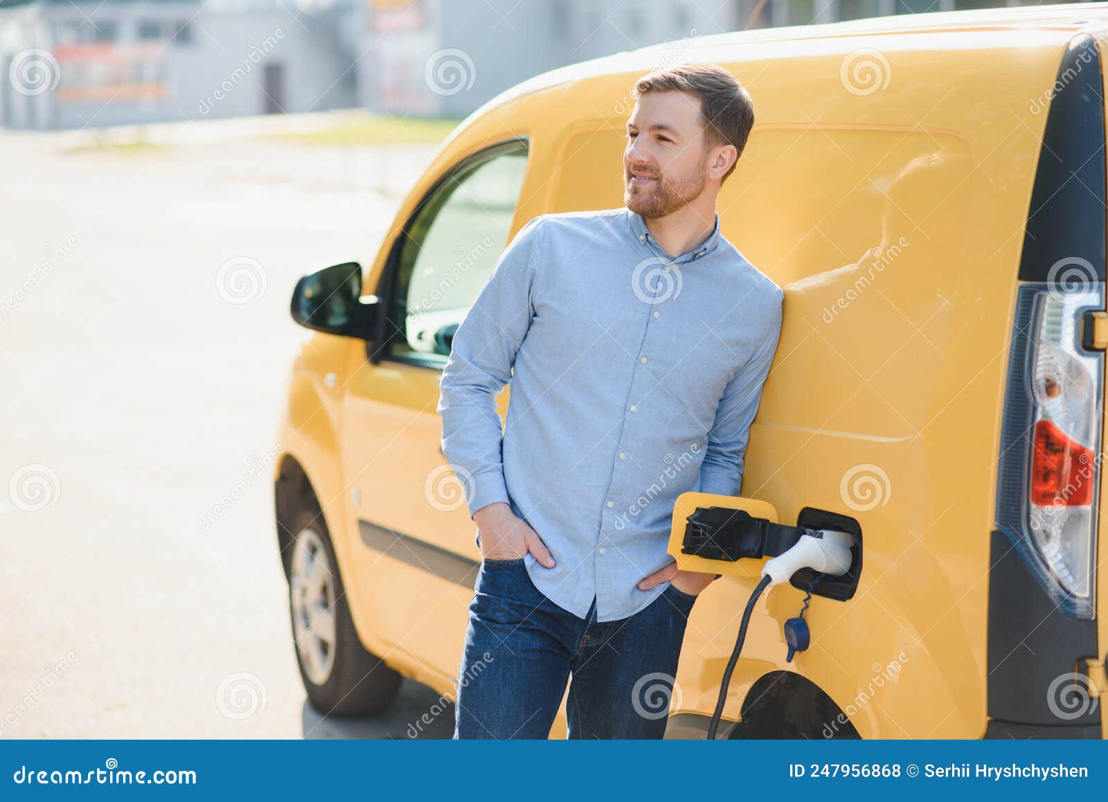 Man Charging His Electric Car at Charge Station. Stock Photo - Image of ...
