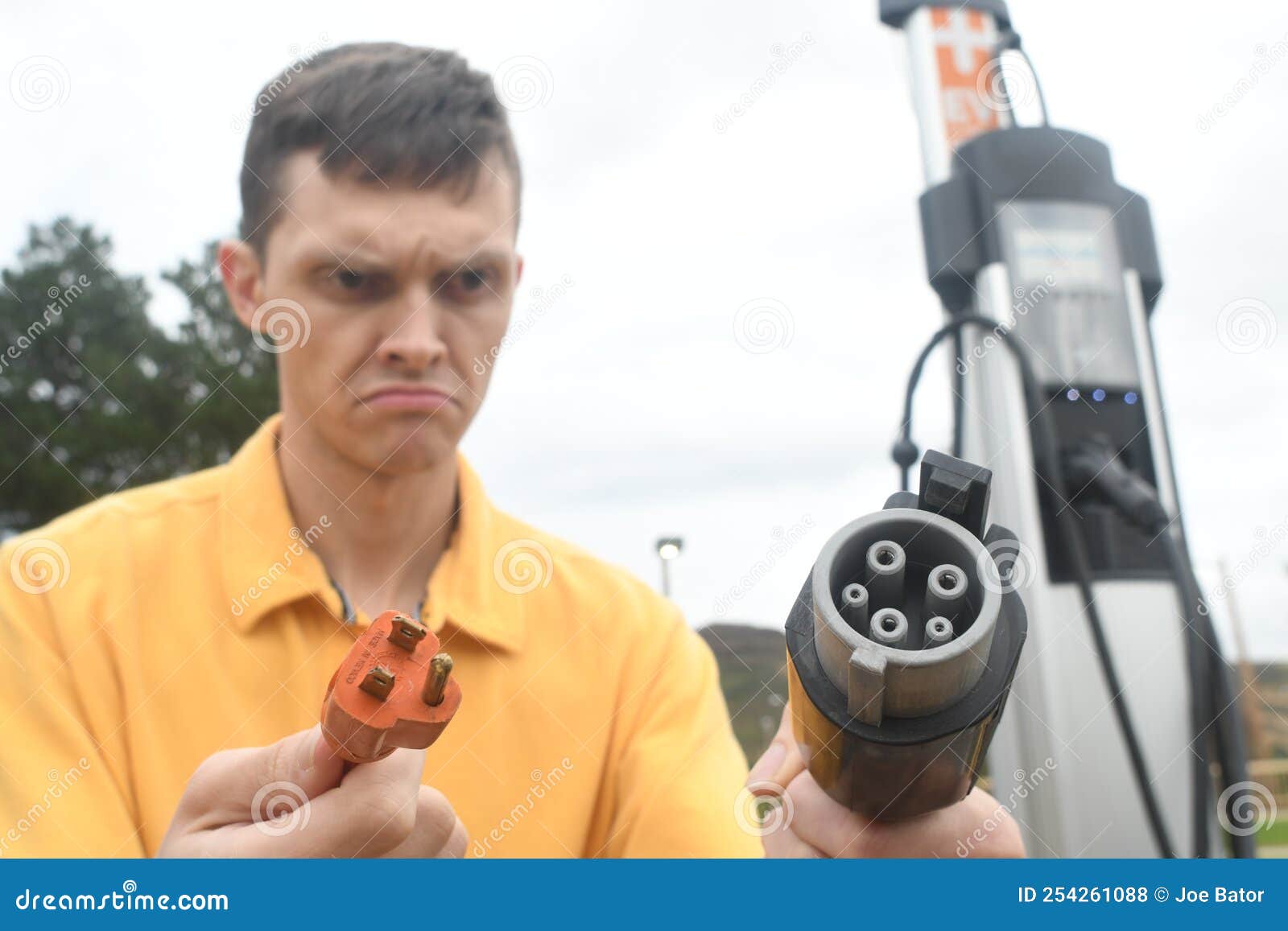Man Charging His Electric Vehicle Stock Photo - Image of battery, range ...