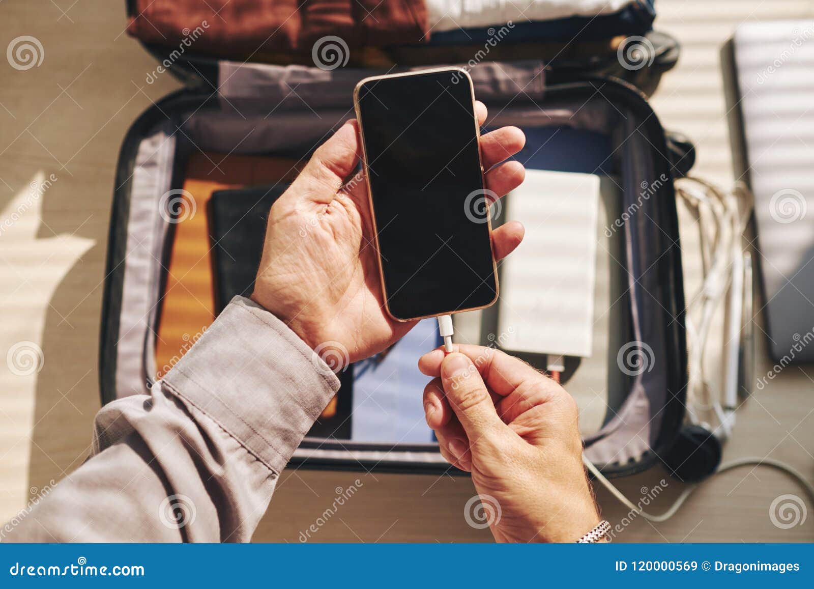 Man charging smartphone stock image. Image of adventure - 120000569