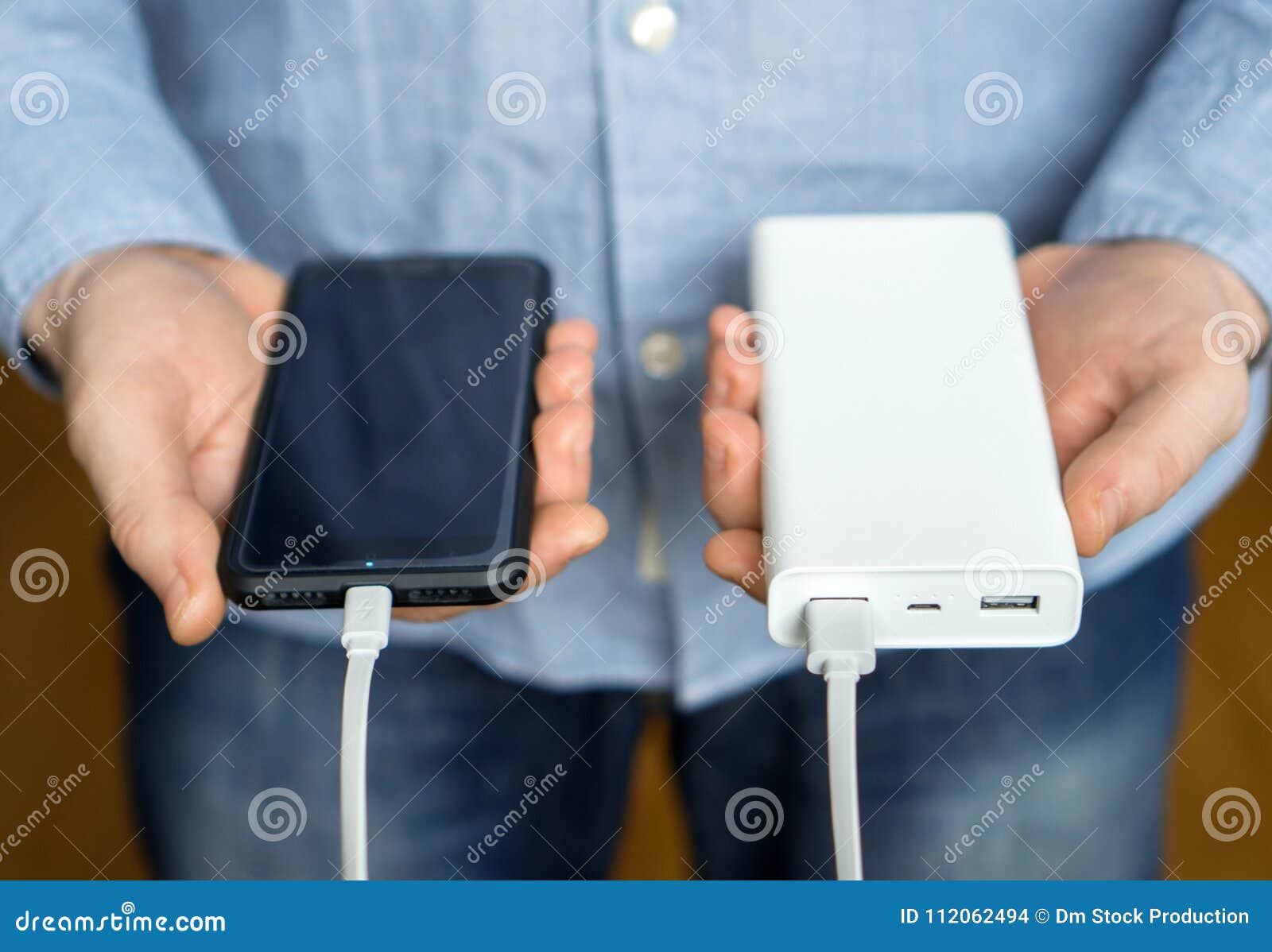 Man charging smartphone. stock photo. Image of cellphone - 112062494