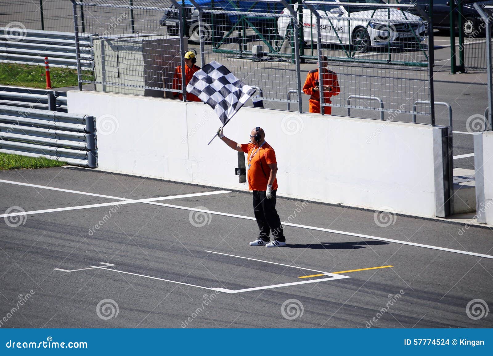 A Man with a Checkered Flag on the Race Bikes Track Editorial Stock ...