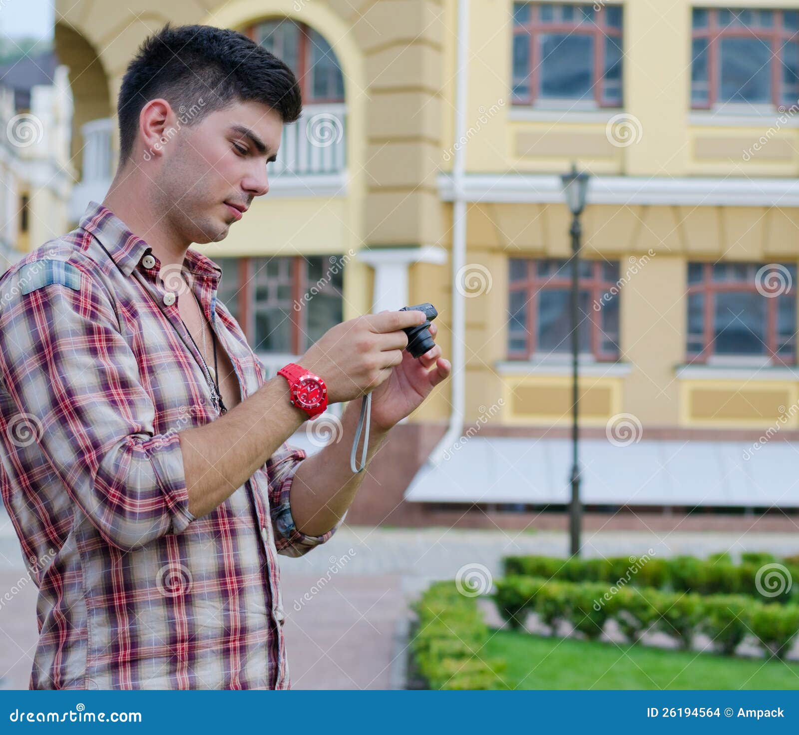 Man Checking the Back of His Camera Stock Photo - Image of check, urban ...