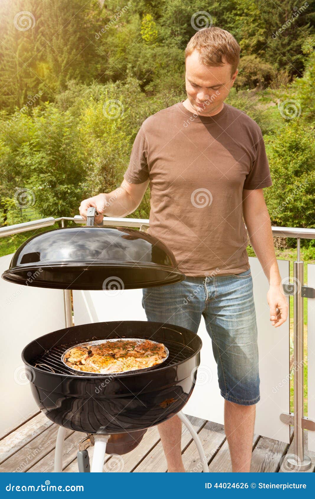 Man checking the bbq chops stock photo. Image of nature - 44024626