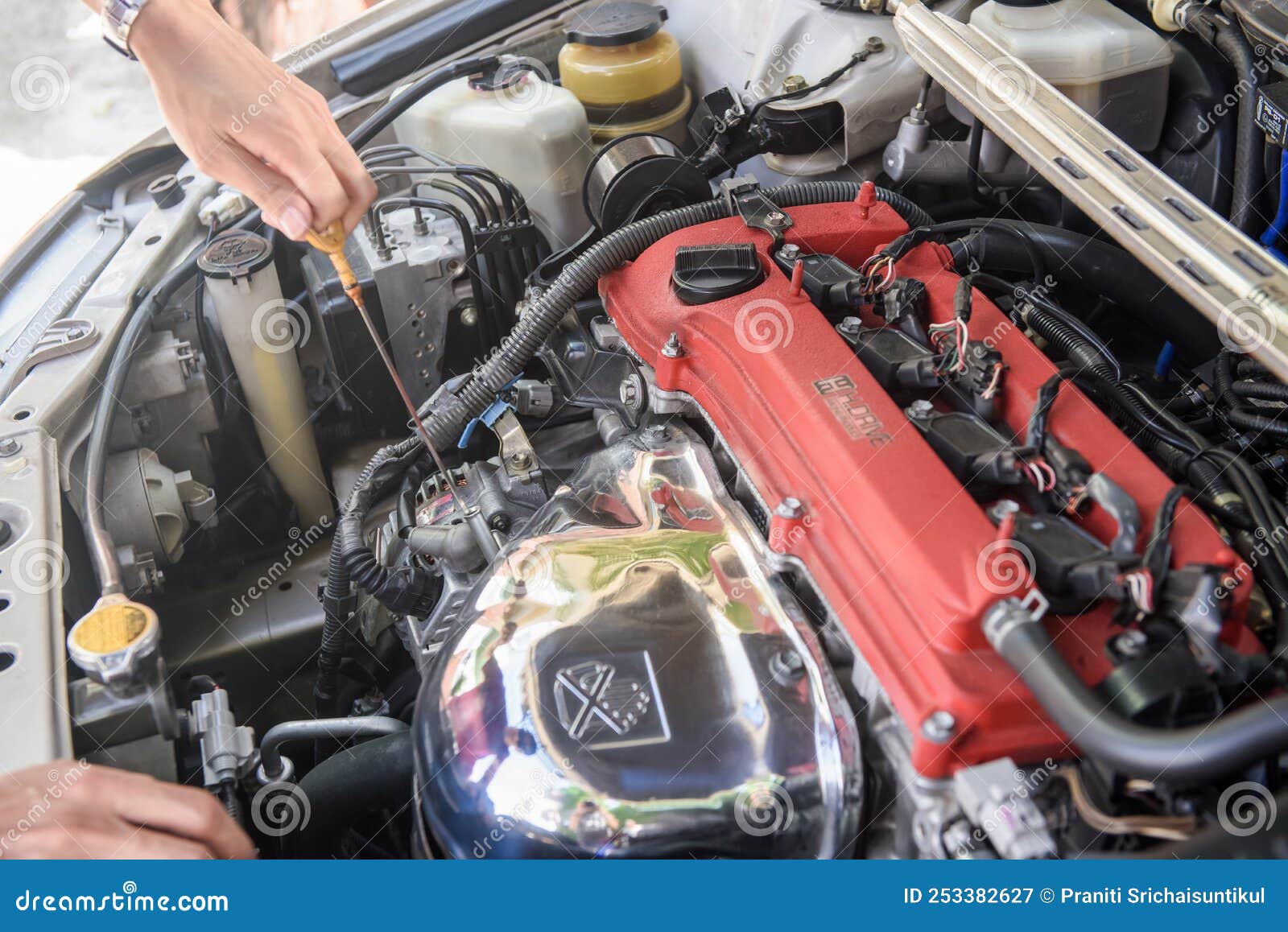 A man checking car engine stock image. Image of hand - 253382627