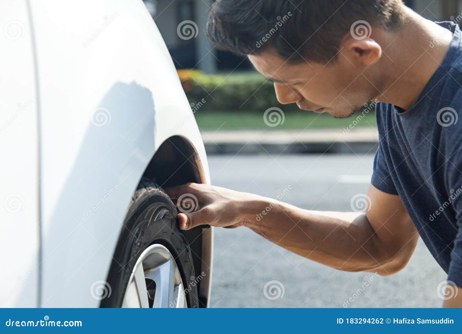 Man checking car tire stock photo. Image of tire, outdoors - 183294262