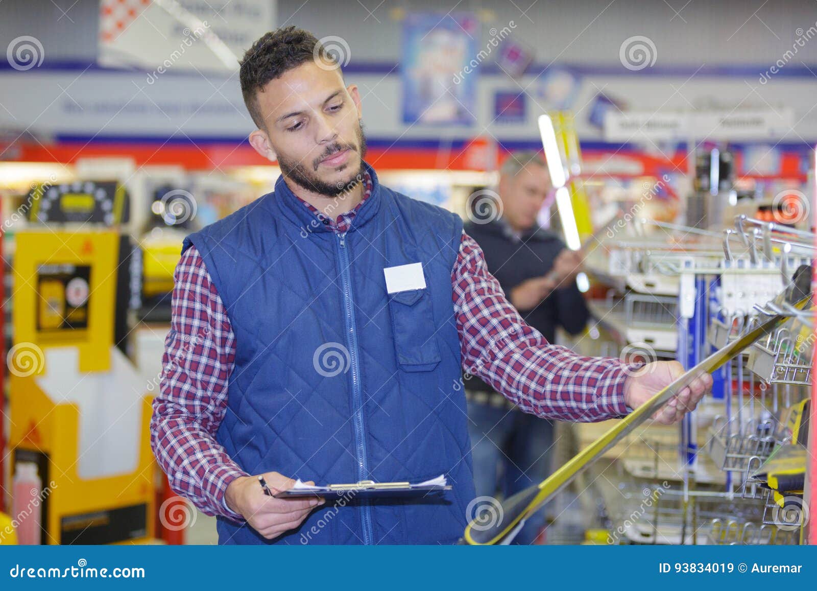 Man Checking Clipboard before Purchasing in Hardware-store Stock Image ...