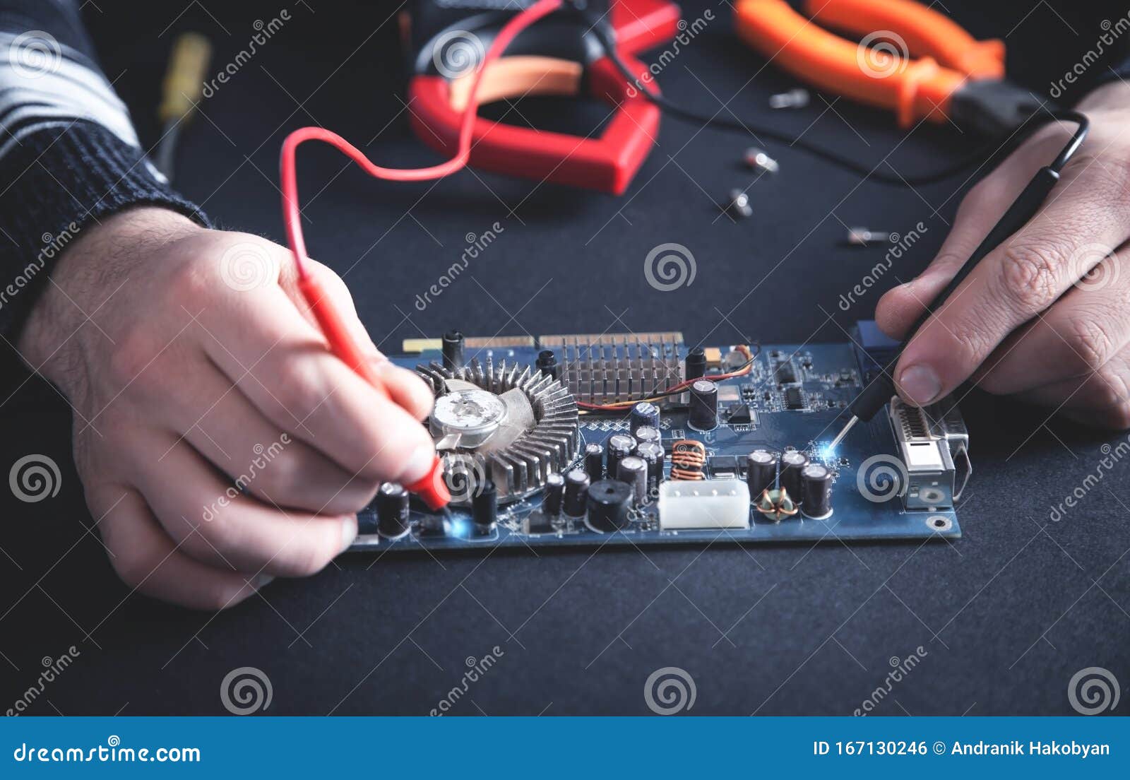 Man Checking Computer Motherboard with a Multimeter Stock Photo - Image ...