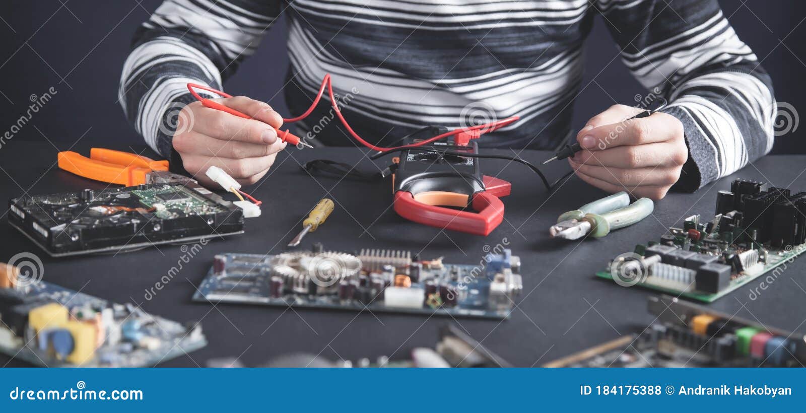 Man Checking Computer Motherboard with a Multimeter Stock Photo - Image ...