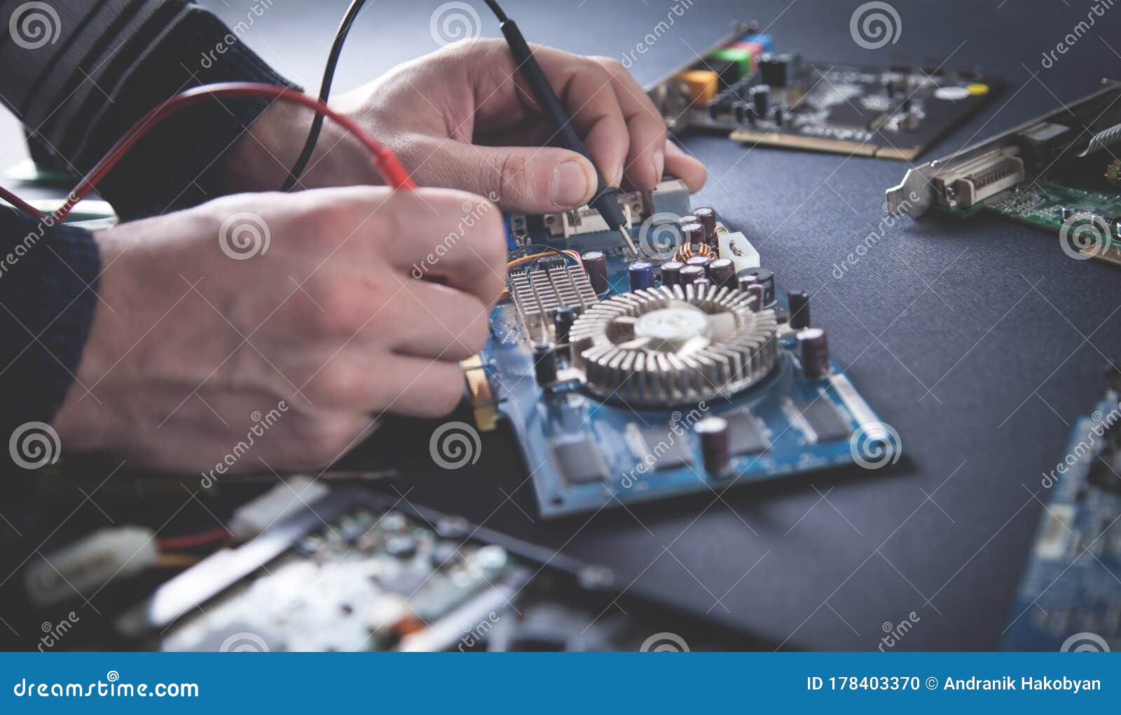 Man Checking Computer Motherboard with a Multimeter Stock Photo - Image ...