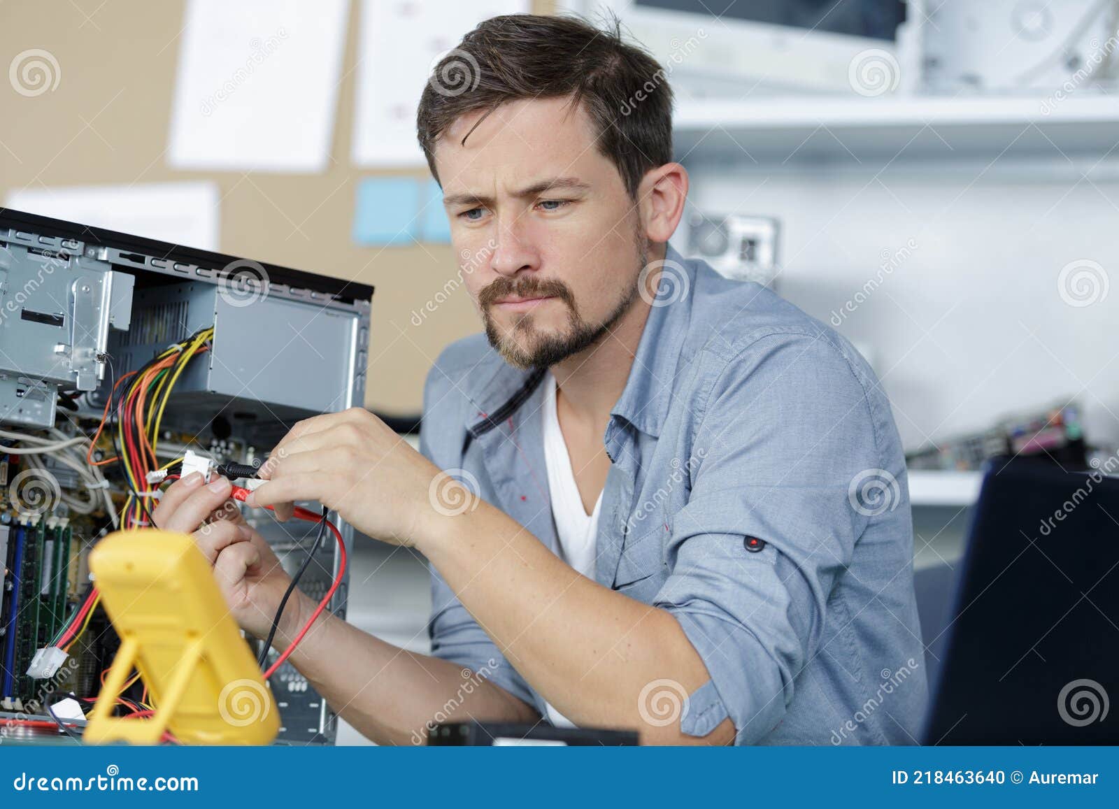 Man Checking Computer with Multimeter Stock Photo - Image of technology ...