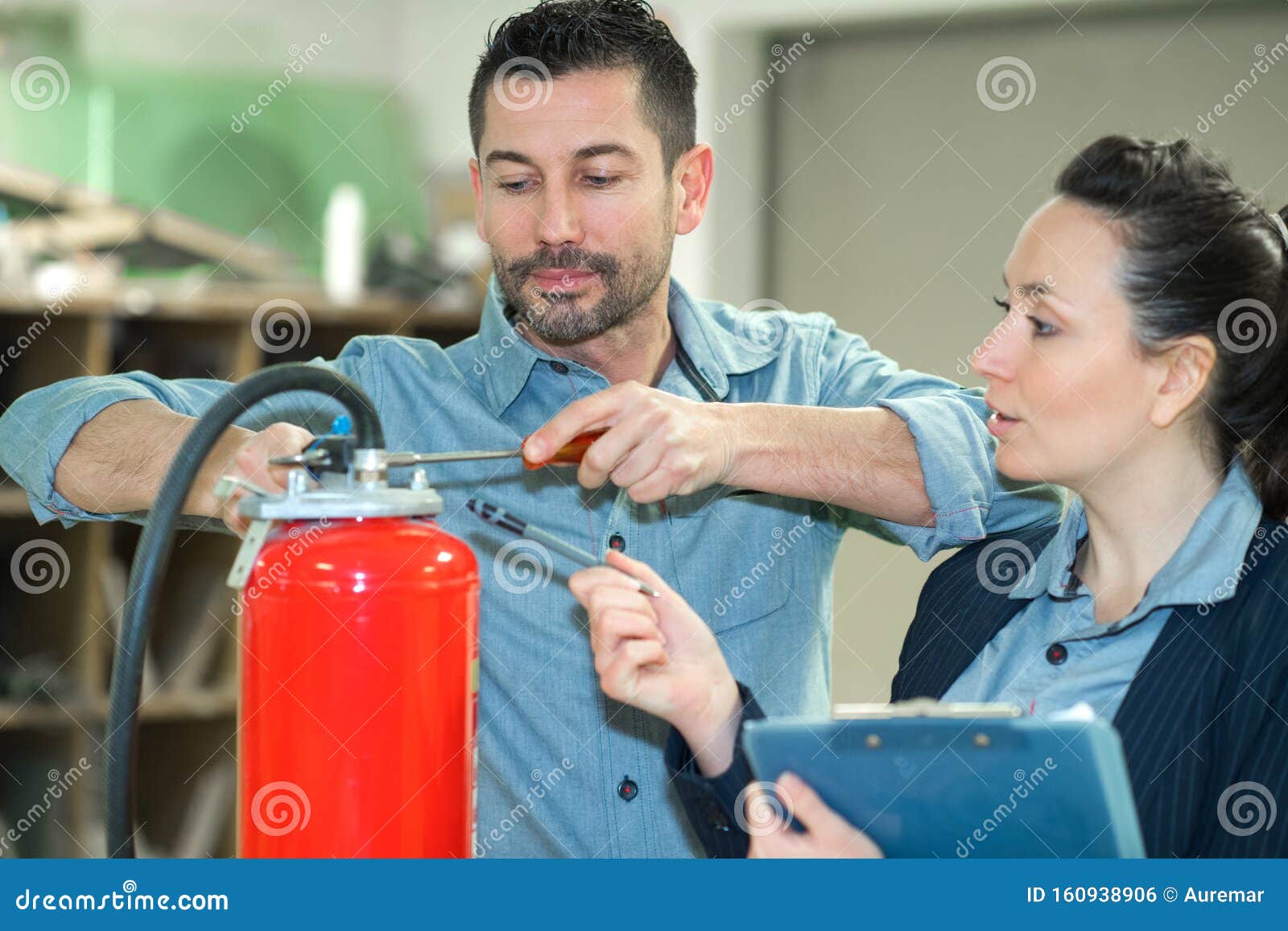 Man Checking Fire Extinguisher Stock Photo - Image of person ...