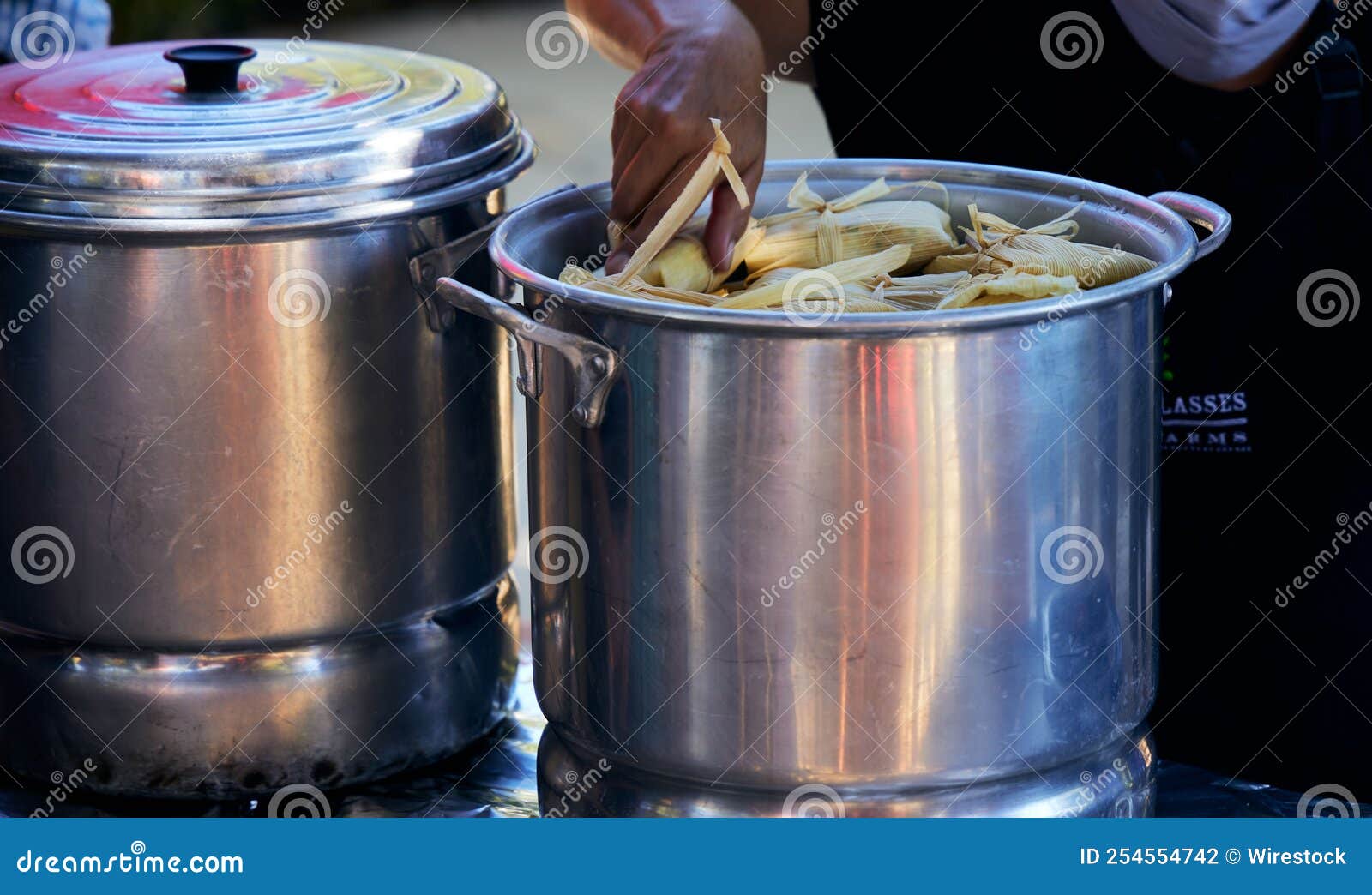 Man Checking the Food on the Silver Container Stock Photo - Image of ...