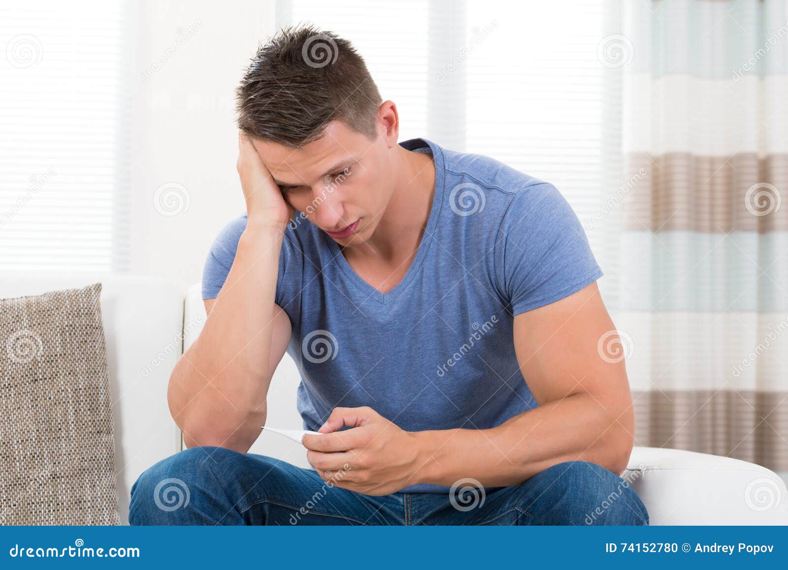 Man Checking His Body Temperature with Thermometer Stock Photo - Image ...